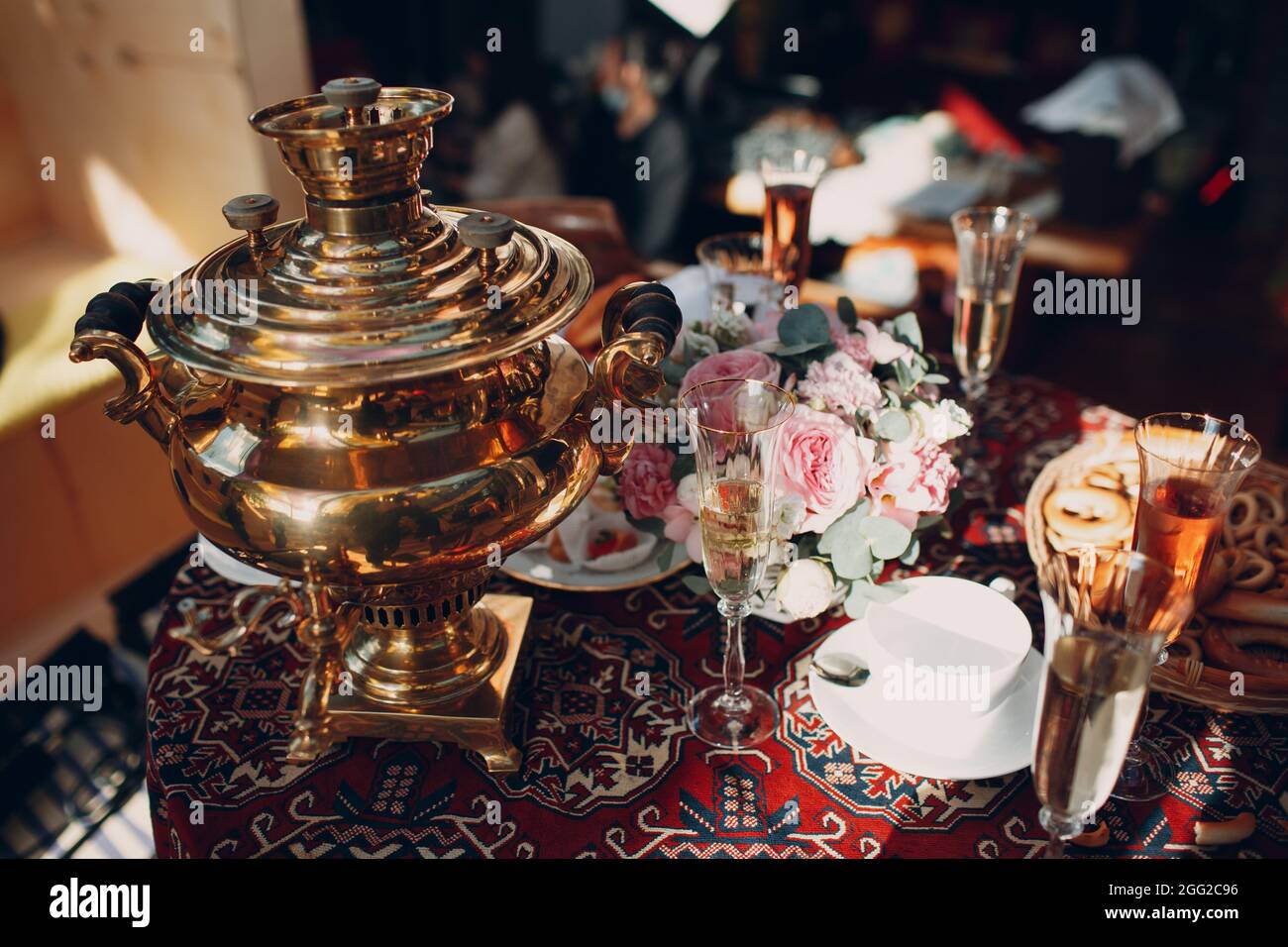 Old traditional Russian table for tea drinking with samovar, glasses of ...