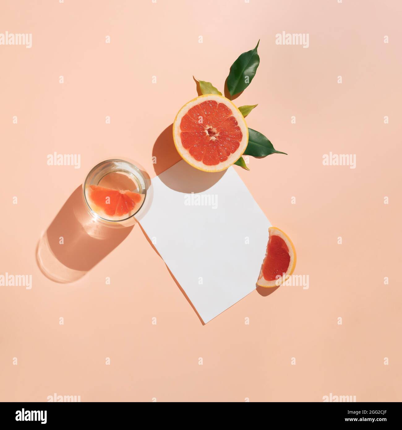 Minimal sunlit fruit composition of grapefruits with shadows and white ...