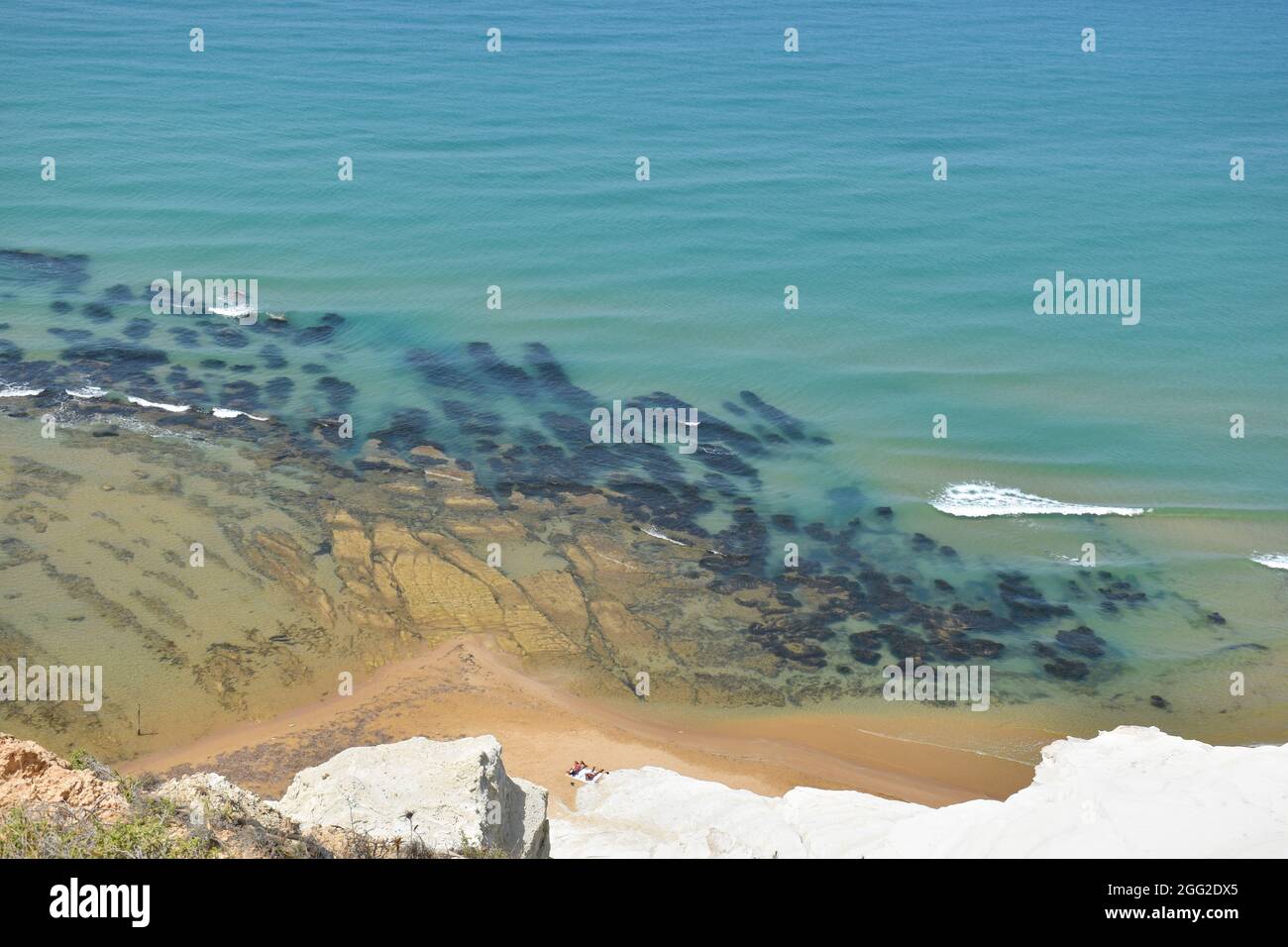 White cliffs above turquoise waters of mediterranean sea at Scala dei ...