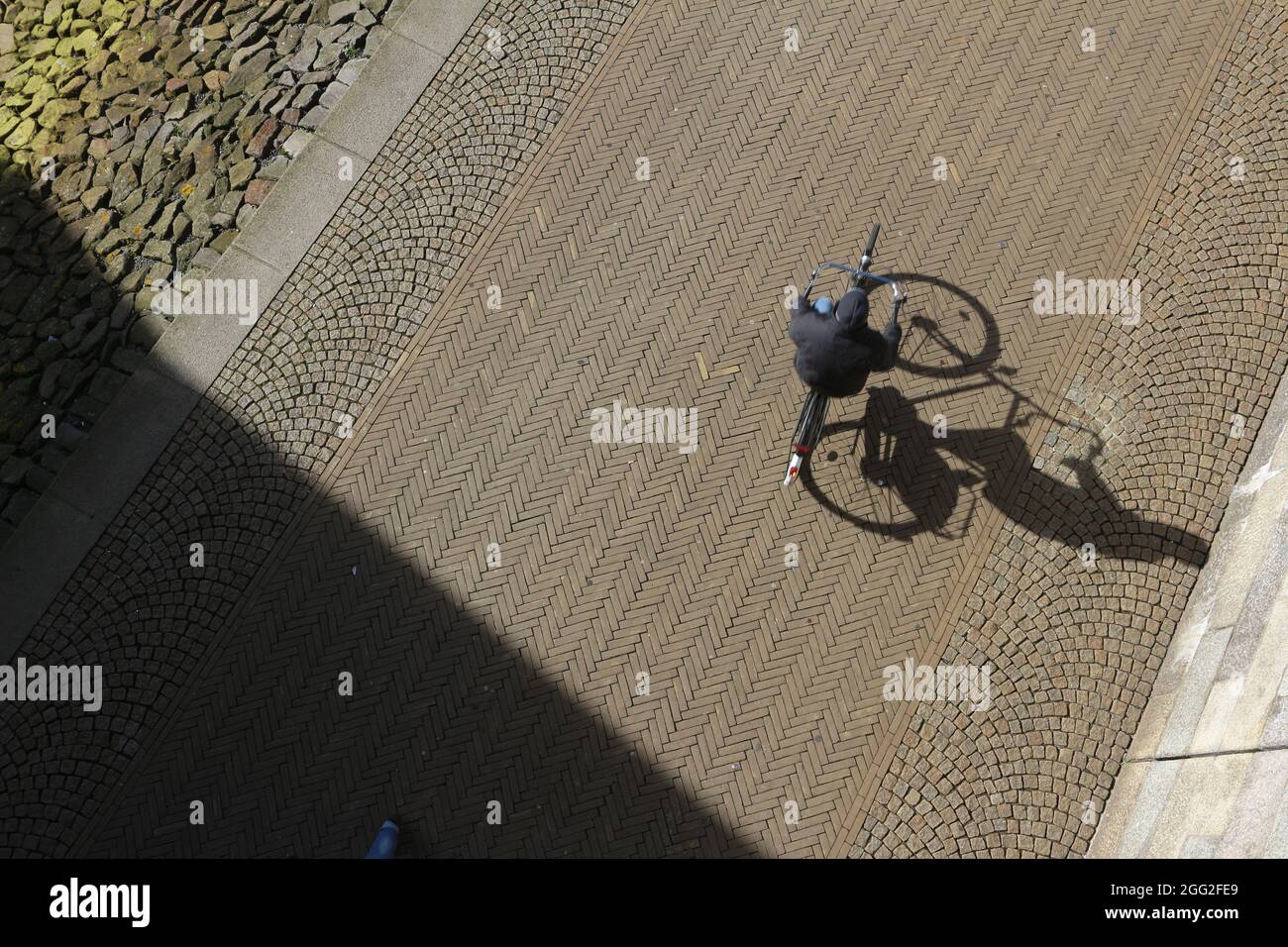 Top view of a cyclist walking with his bicycle Stock Photo - Alamy