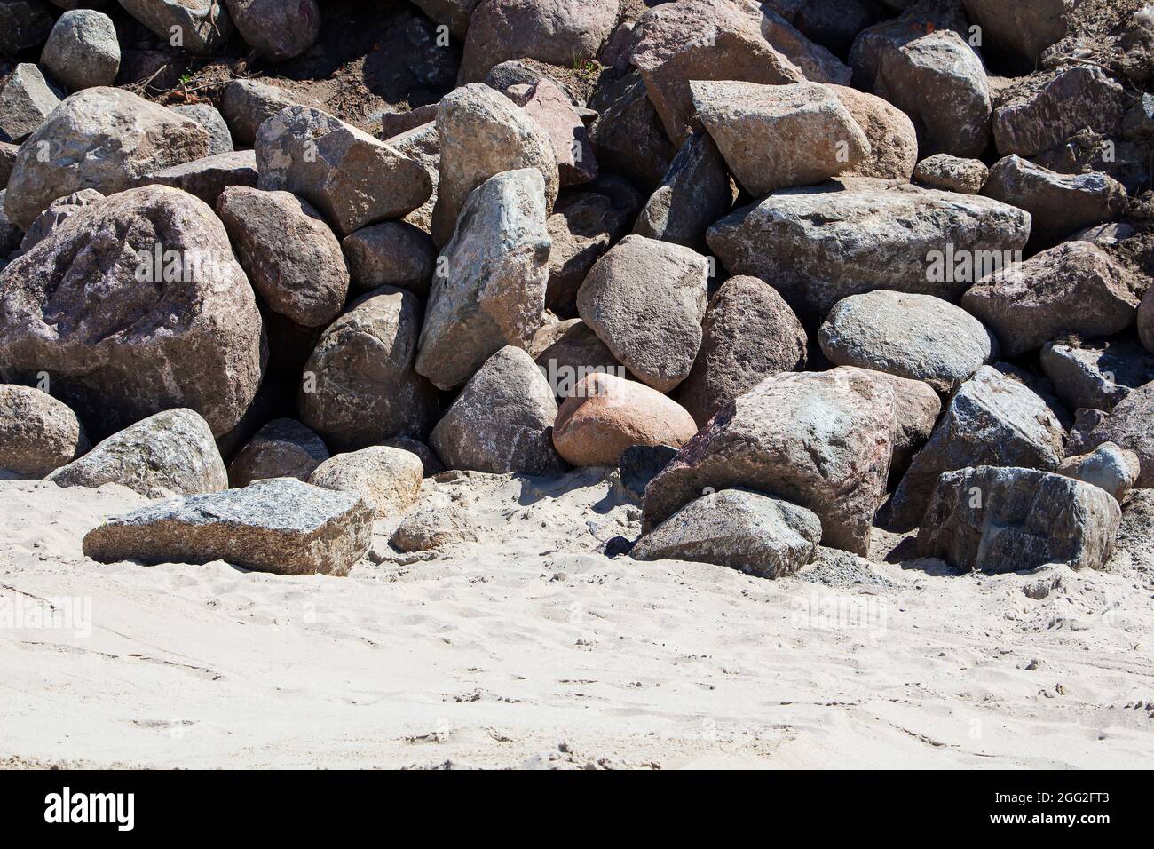Rockfall on the road in the mountains. Stones of different sizes ...