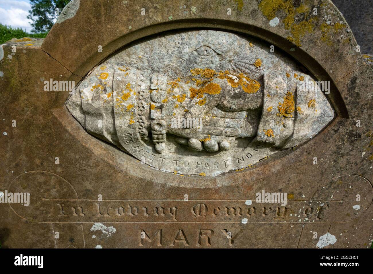 clasping or shaking hands on cemetery tombstones Stock Photo - Alamy