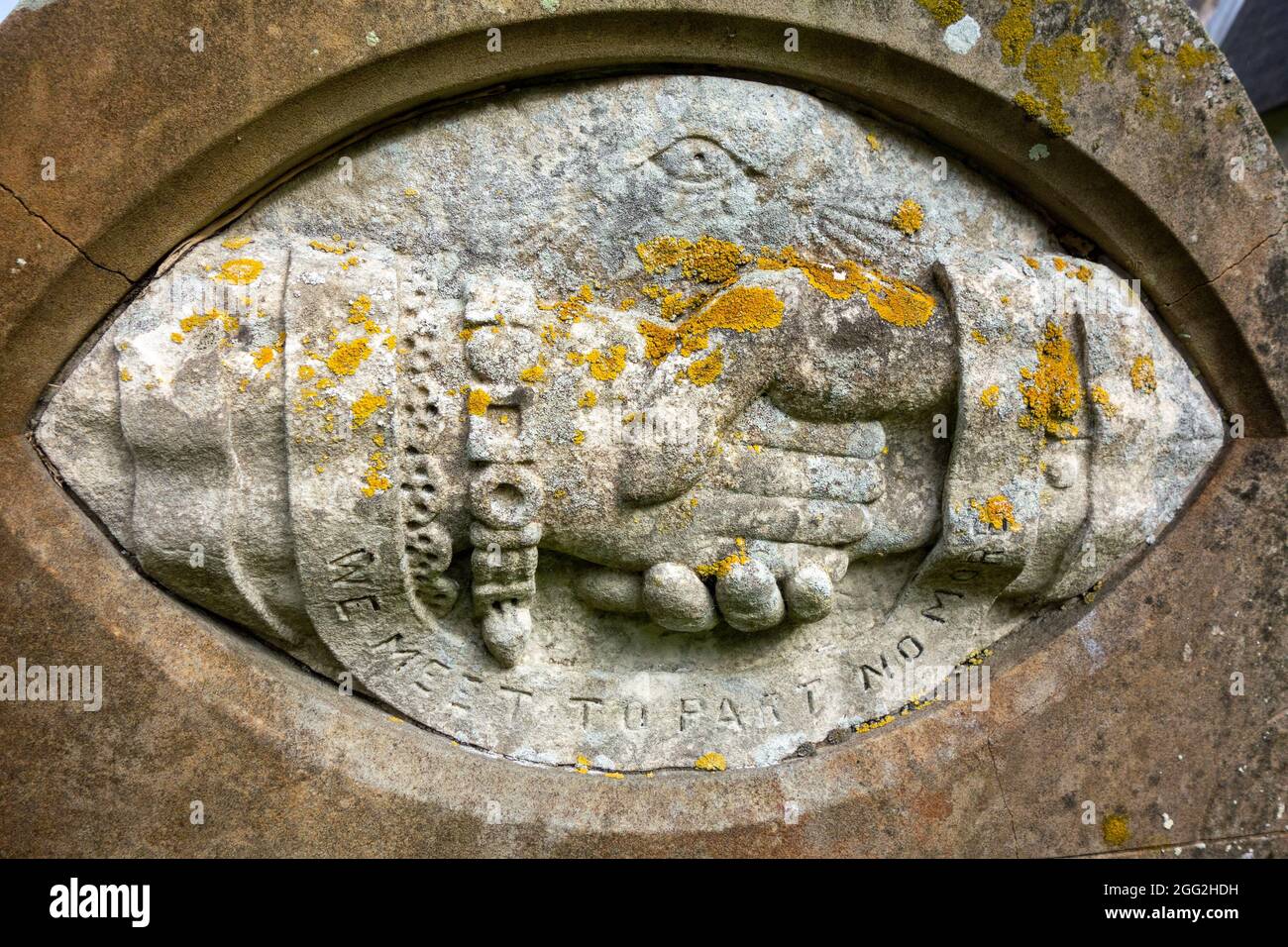 clasping or shaking hands on cemetery tombstones Stock Photo - Alamy