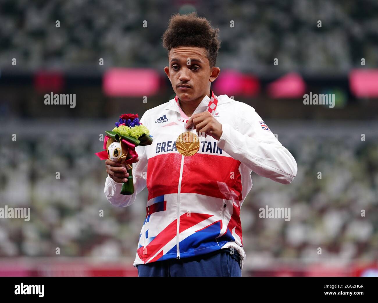 Great Britain's Thomas Young celebrates with his gold medal won in the ...