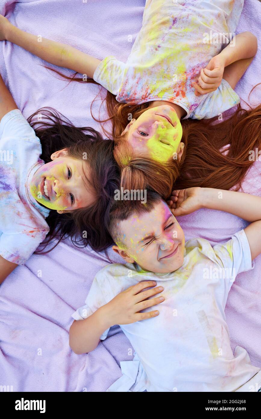 children with colored powder having fun outdoor Stock Photo - Alamy