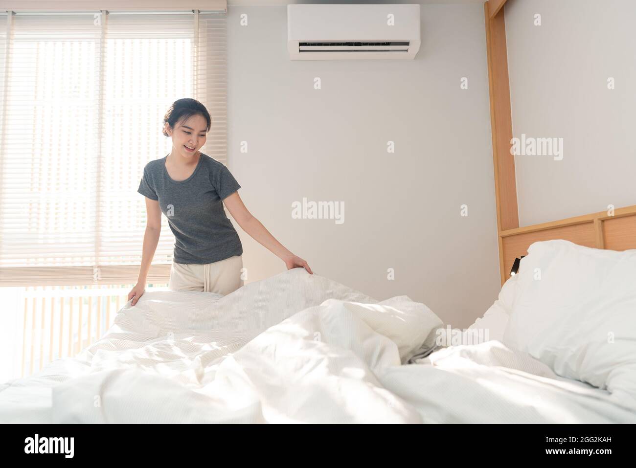 Bedroom concept a female adult doing the routine by grabbing the edge ...