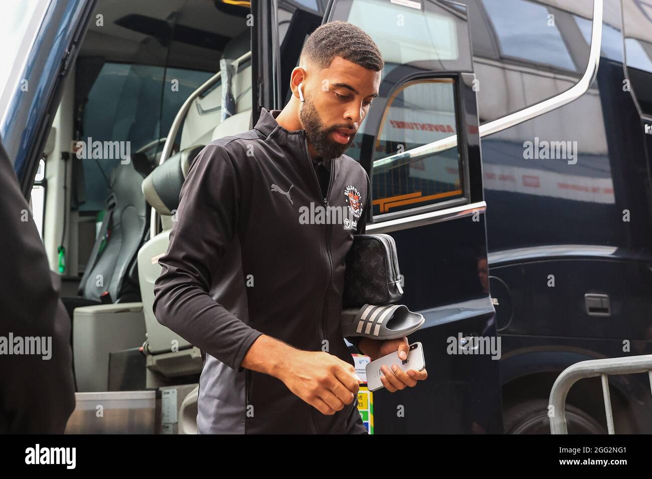 Cj Hamilton #22 of Blackpool arrives at The Den Stock Photo - Alamy