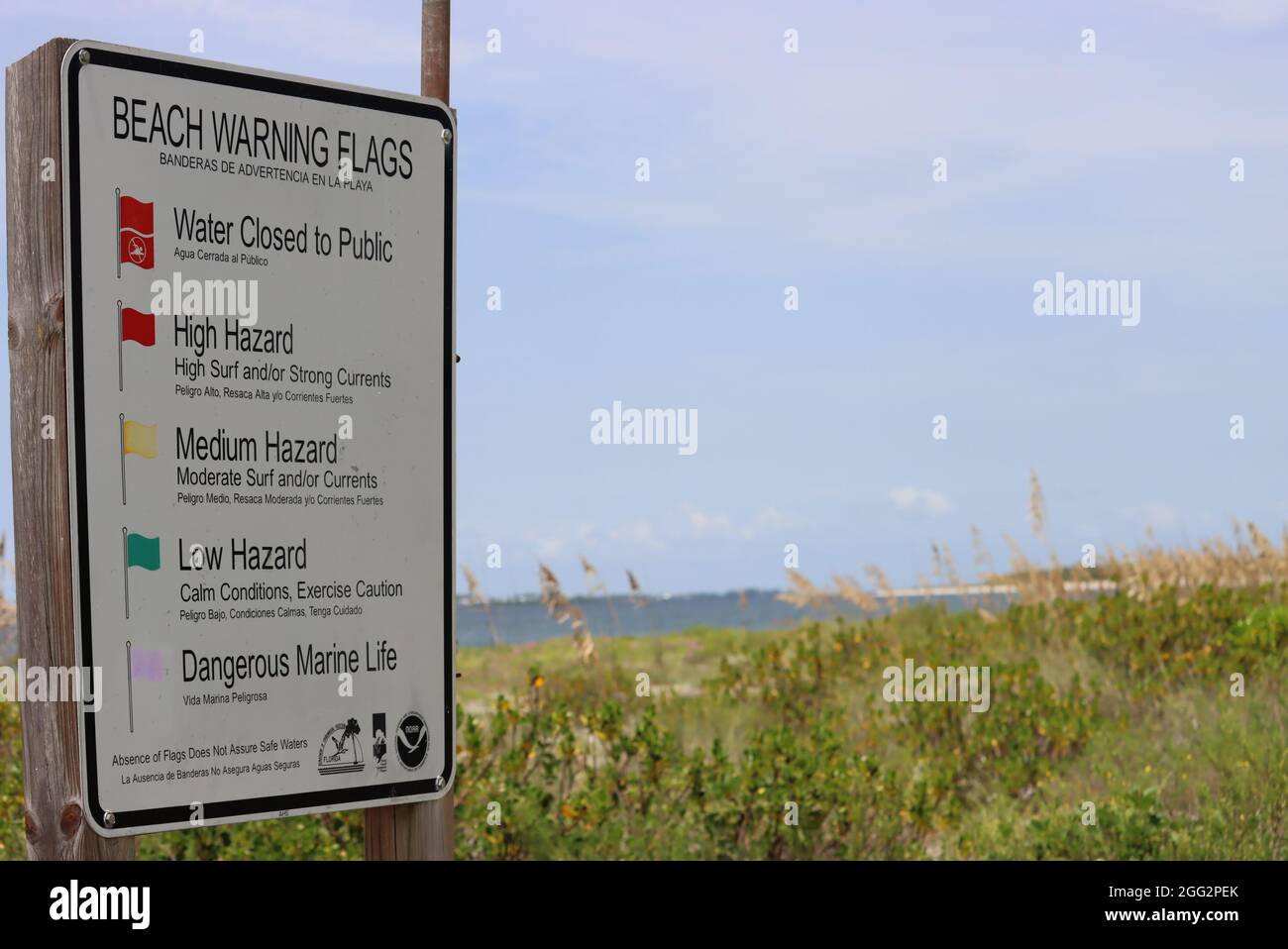 Beach hazard warning flags sign at the beach Stock Photo - Alamy