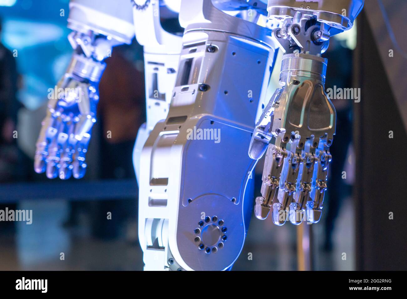 Closeup of metal robot hand. Concept of modern technology. Blue tone ...
