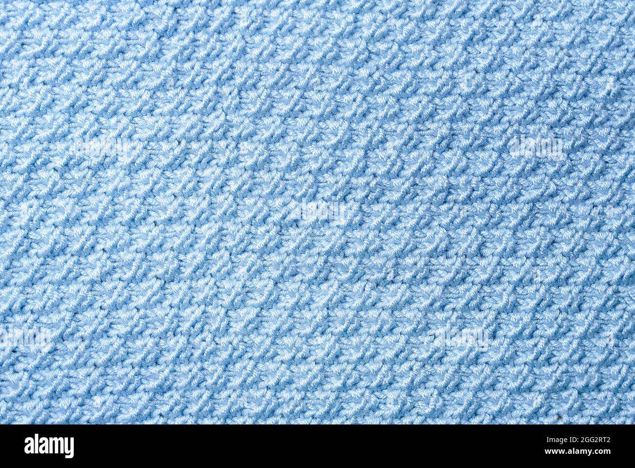 Knit texture of blue wool knitted fabric with pattern background. Place ...