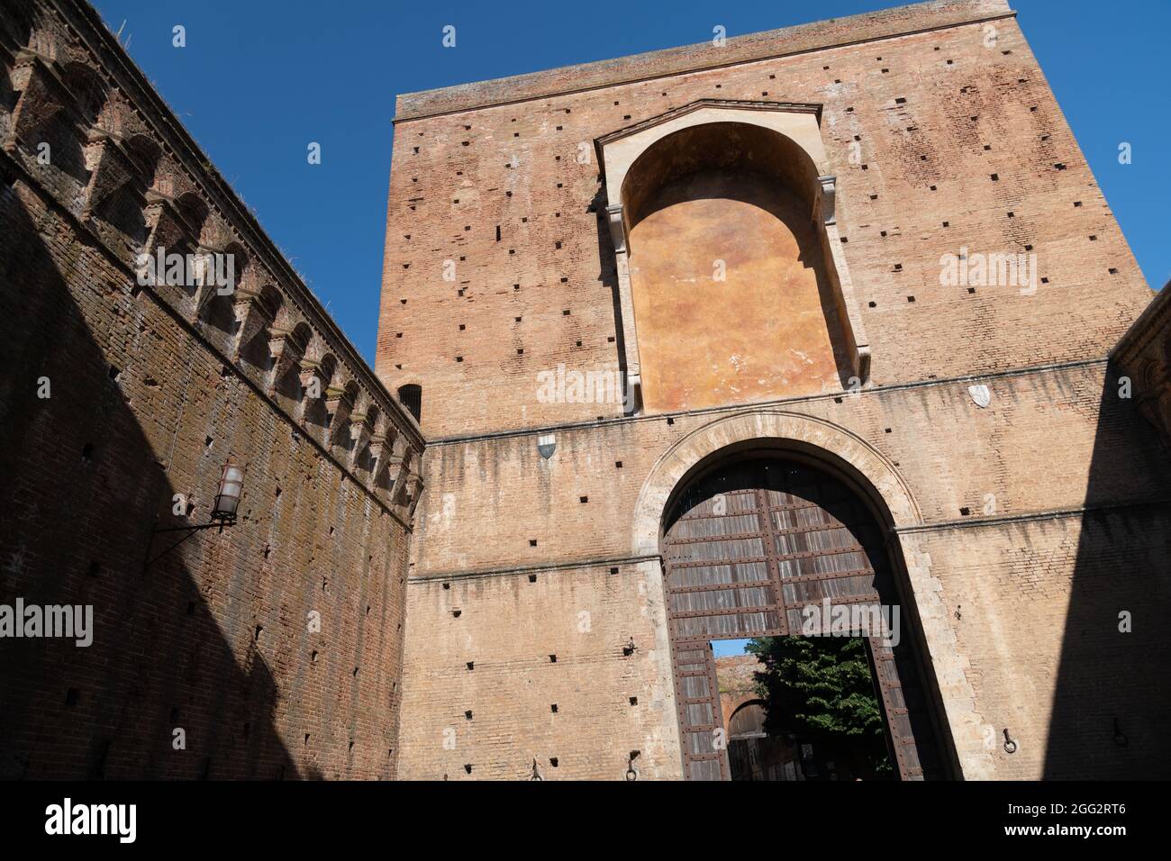 Porta Ovile, Imposing city gate from the 13th century with a curved ...