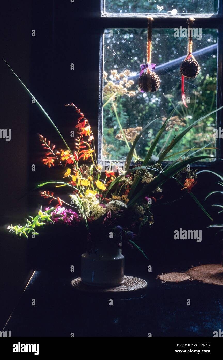 Flowers on a window. Still life in an Irish cottage Stock Photo - Alamy