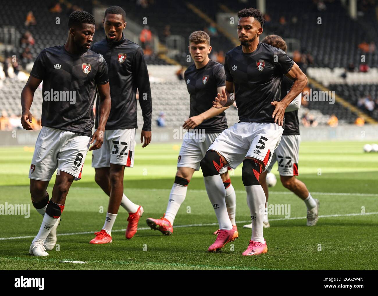 Bournemouth Captain Lloyd Kelly (right) and team mates warm up before ...