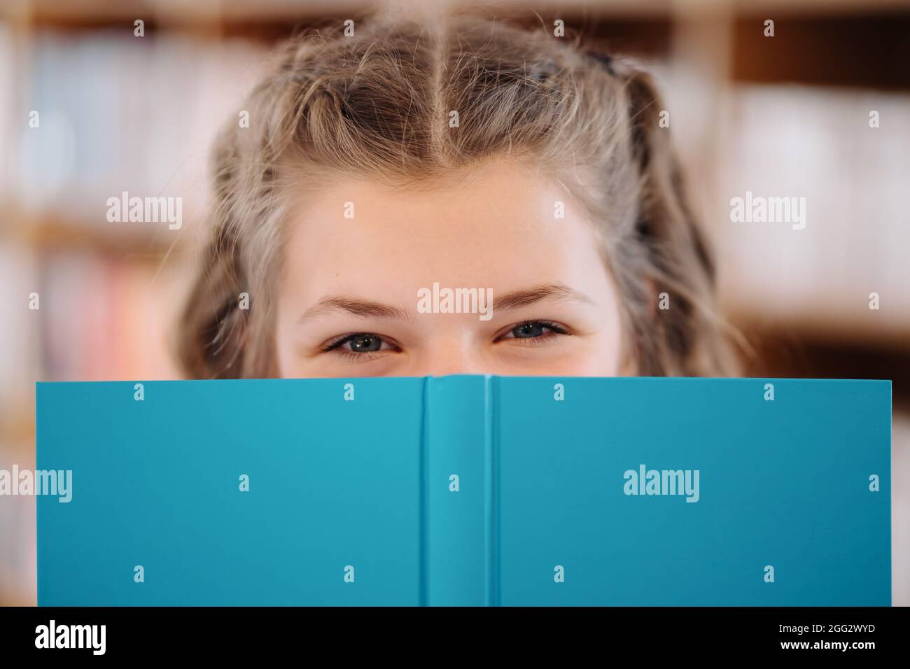 Beautiful girl holding open book hi-res stock photography and images ...