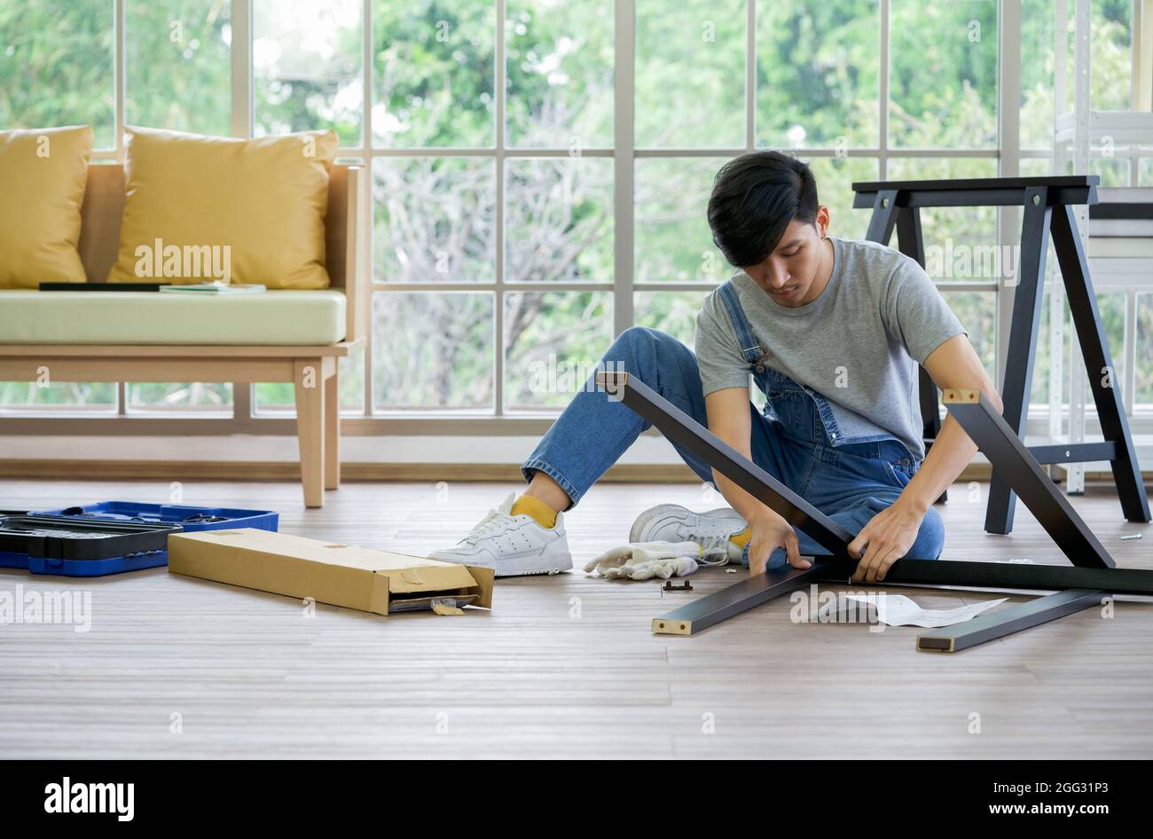Handyman installing wooden bench in new house. House renovation service ...