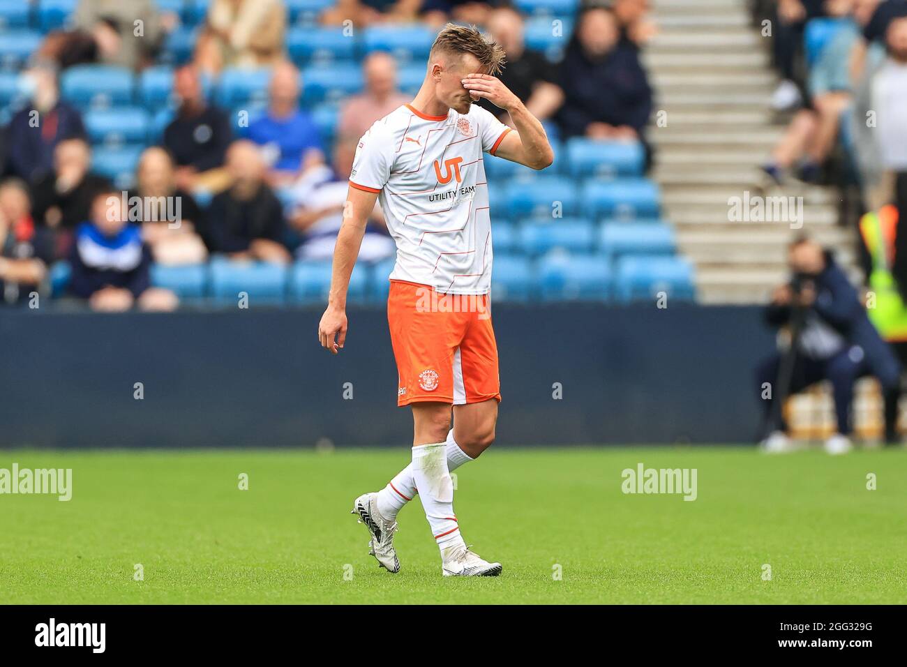 Callum Connolly #2 of Blackpool leaves the pitch after receiving a red ...