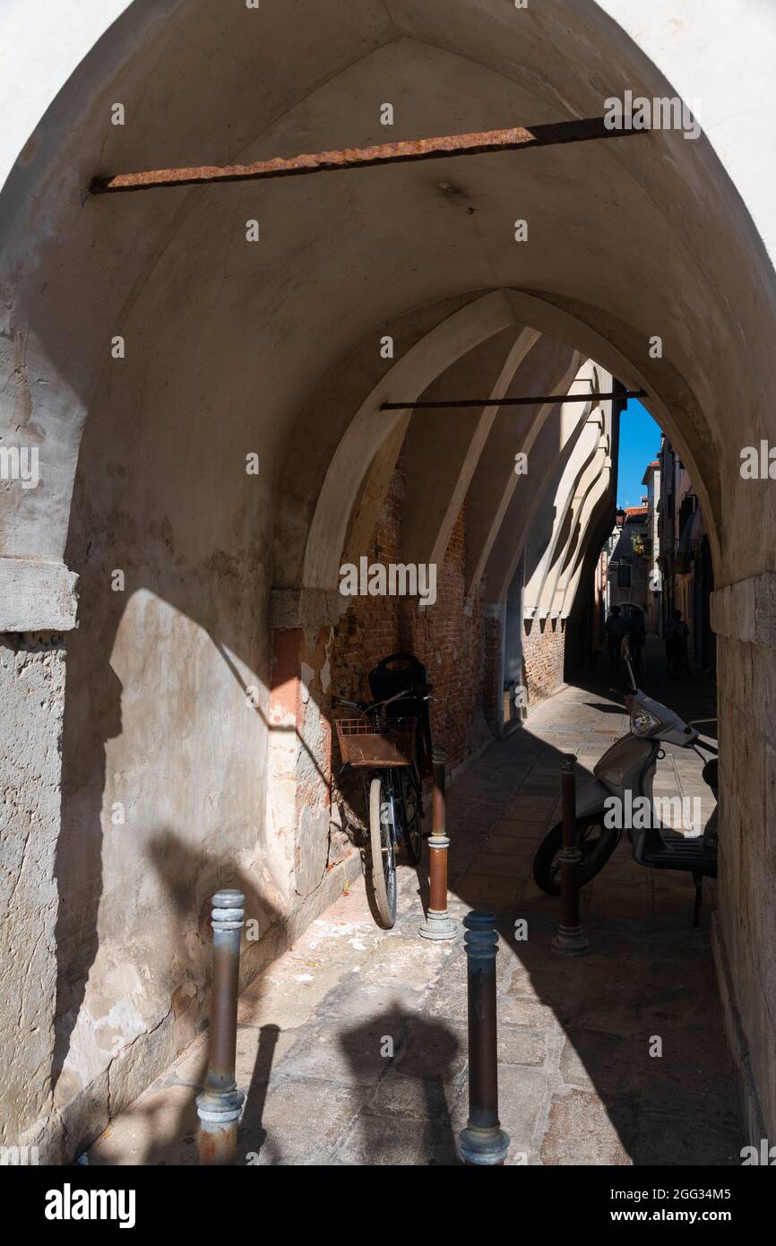 row of colorful multicolored buildings on main street Corso del Popolo ...