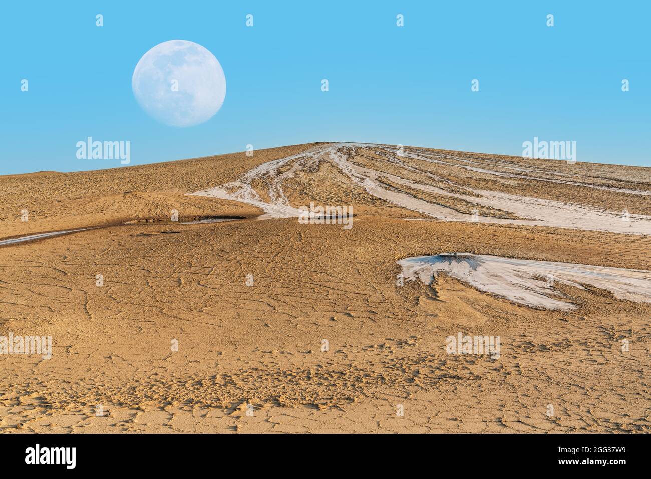 Rising moon over mud volcano Stock Photo - Alamy