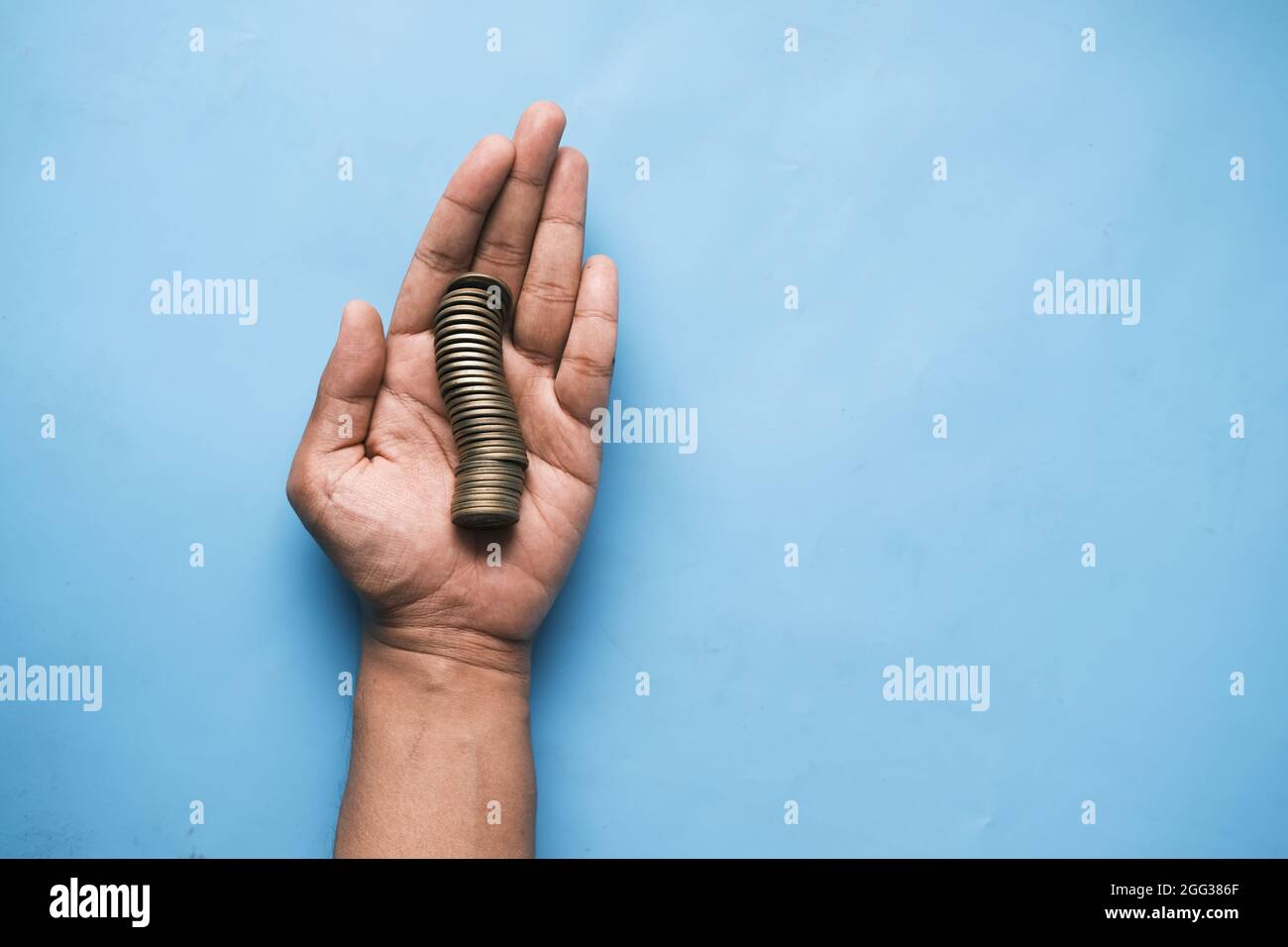 Blue human hand giving money hi-res stock photography and images - Alamy