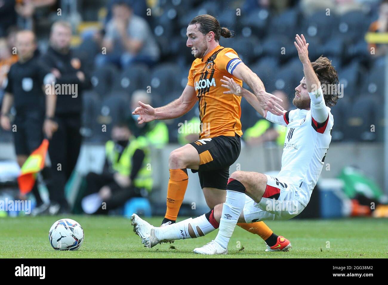 Lewis Coyle #2 of Hull City gets to the ball before Ben Pearson #22 of ...