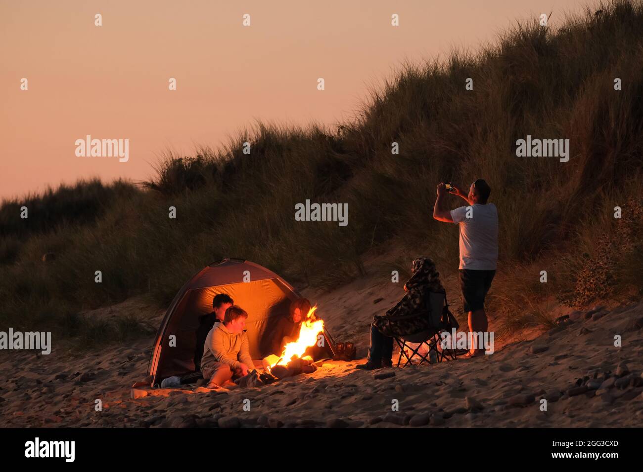 Summer campfires on the beach at Llangennith, Gower peninsula, near ...