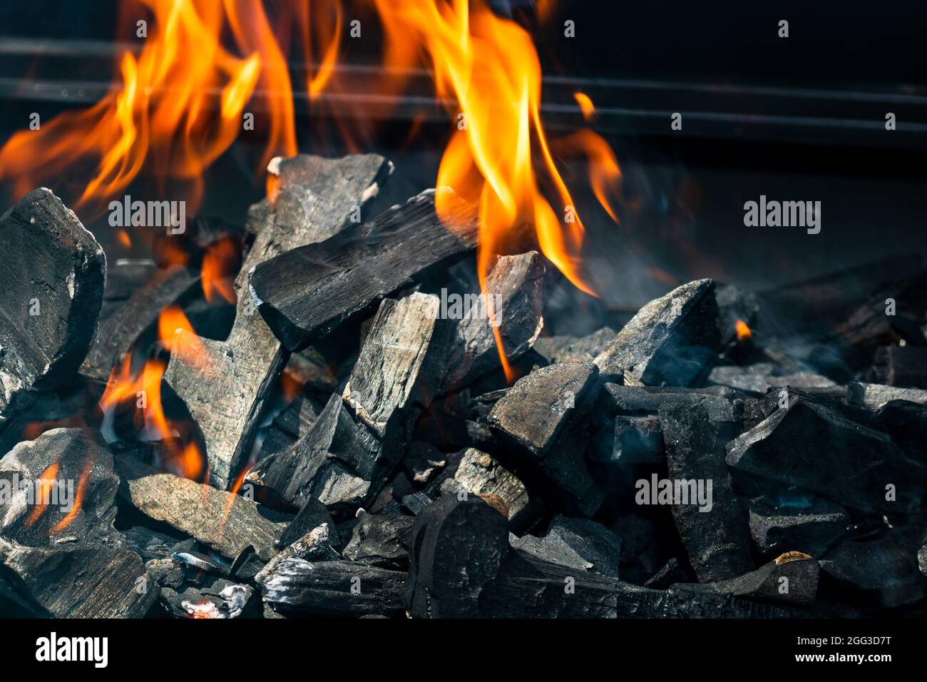 Barbecue grill pit with glowing and flaming hot open fire with red ...