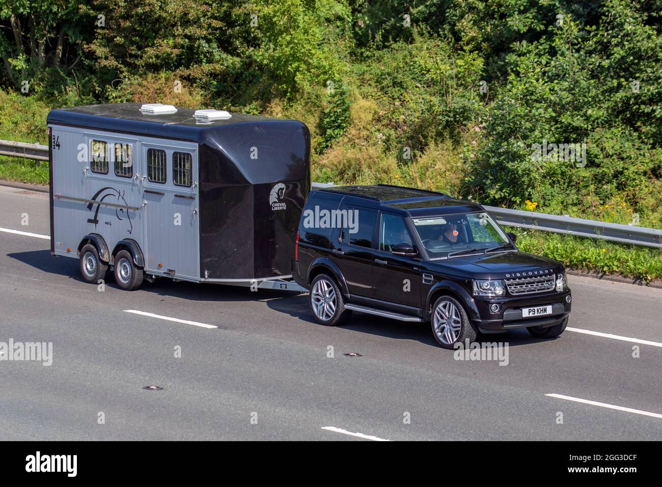 Range Rover Discovery towing horsebox on the M61 motorway, UK Stock ...