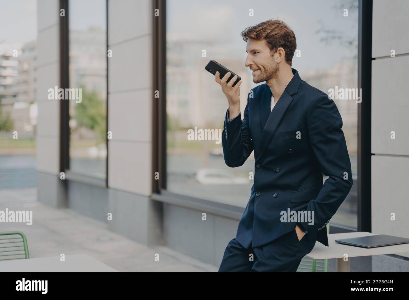 Man leaning table suit hi-res stock photography and images - Alamy