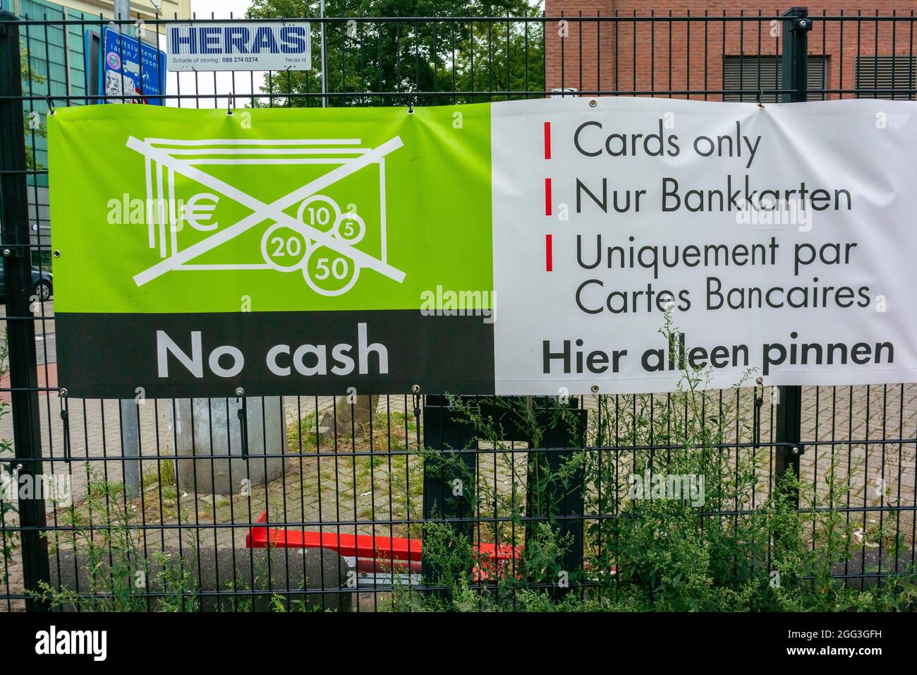 Amsterdam, Holland, Detail SIgn on Fence on Street reading "No Cash ...