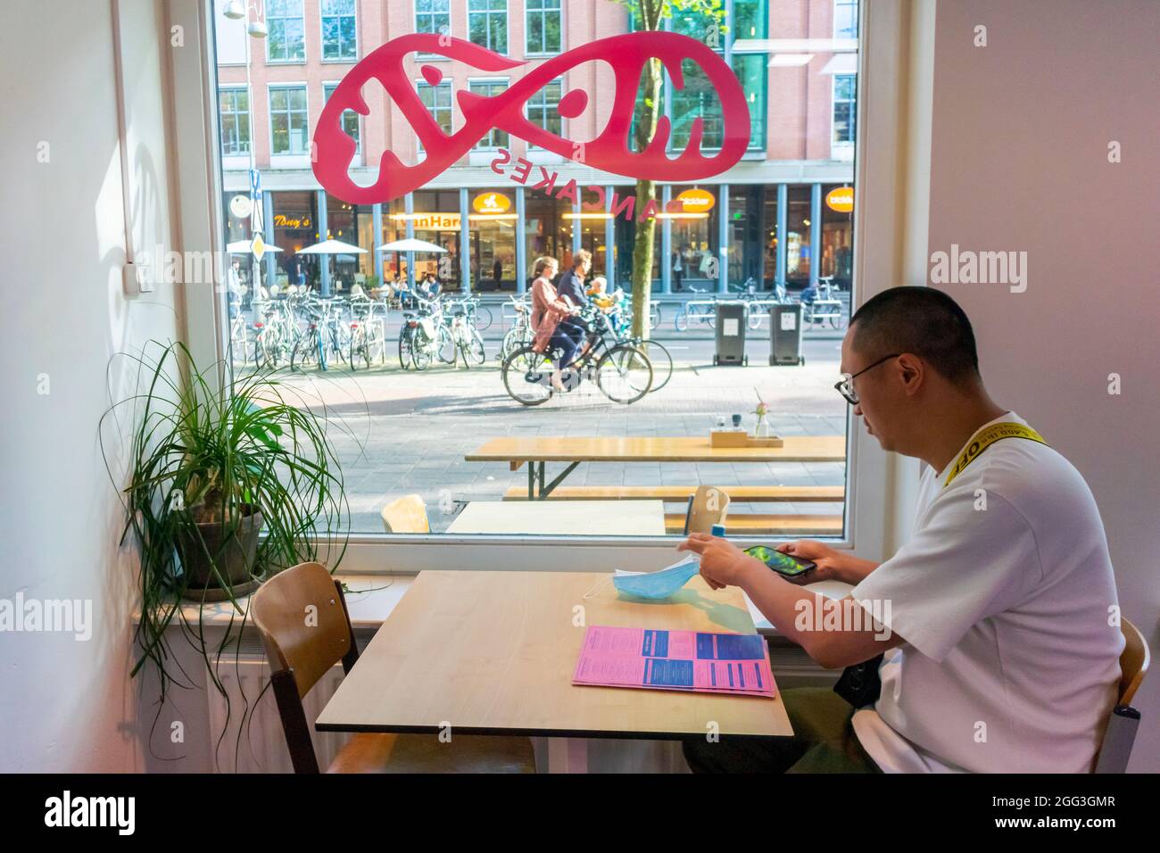 Amsterdam, Holland, Chinese Tourist at table inside Dutch Pancake ...