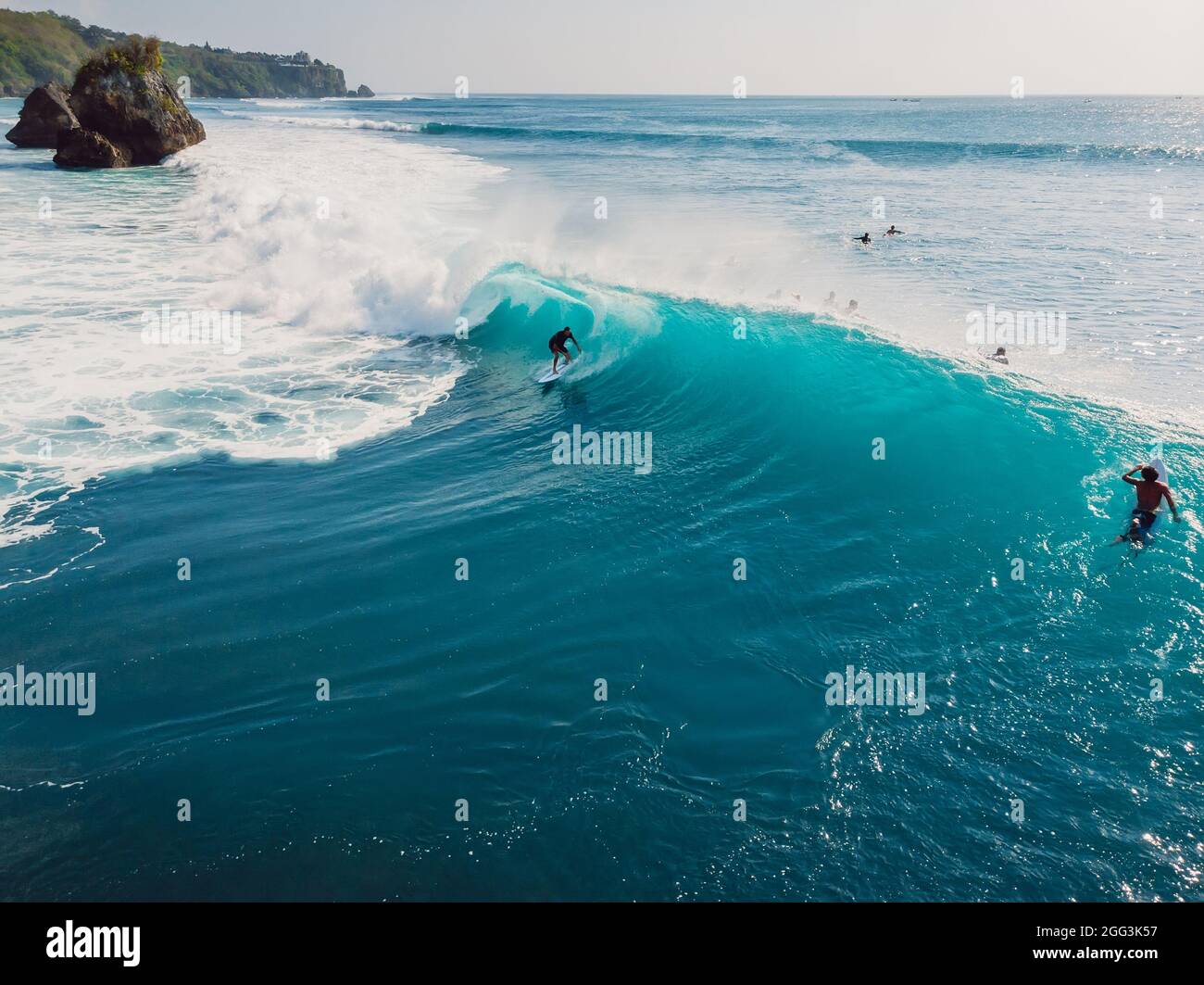 August 8, 2021. Bali, Indonesia. Aerial view with surfing on big barrel ...