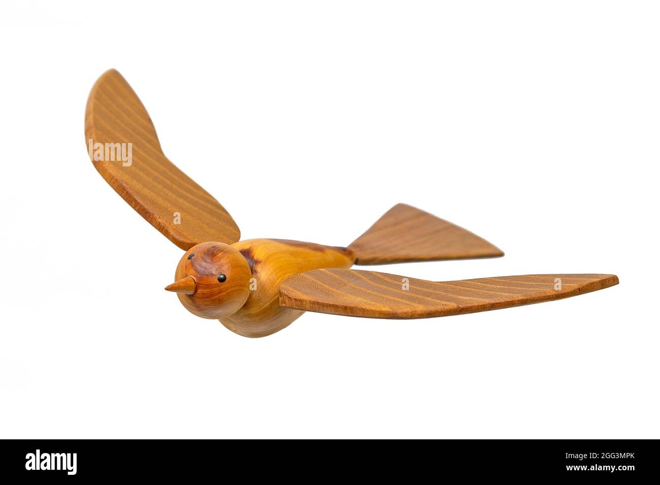 Wooden model of a turned flying bird isolated on white Stock Photo - Alamy