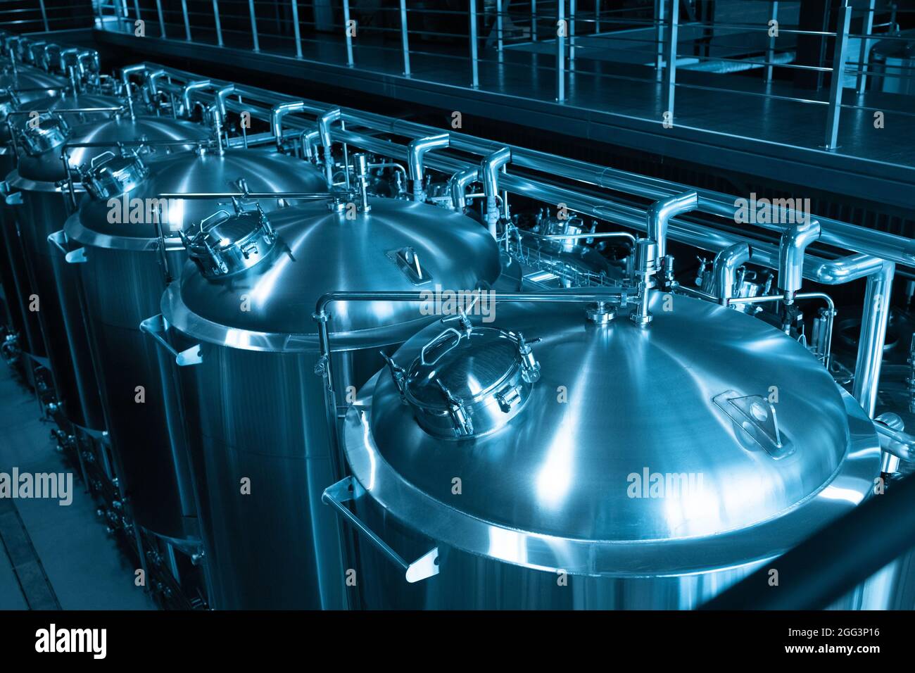Private microbrewery. Modern beer plant with brewering kettles, tubes ...