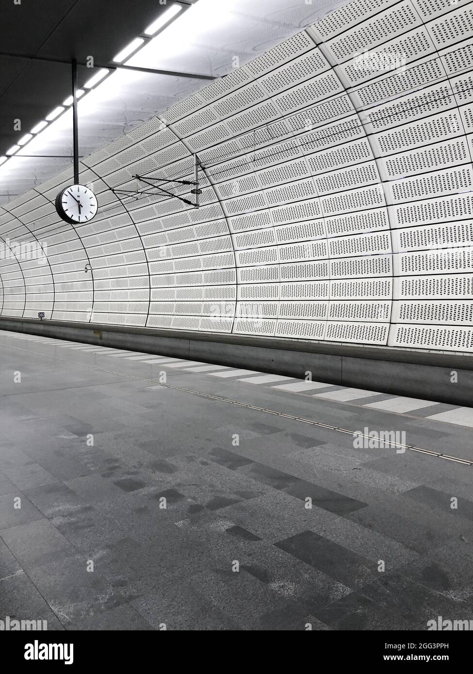Photo of an underground train station, a clock and modern architecture ...