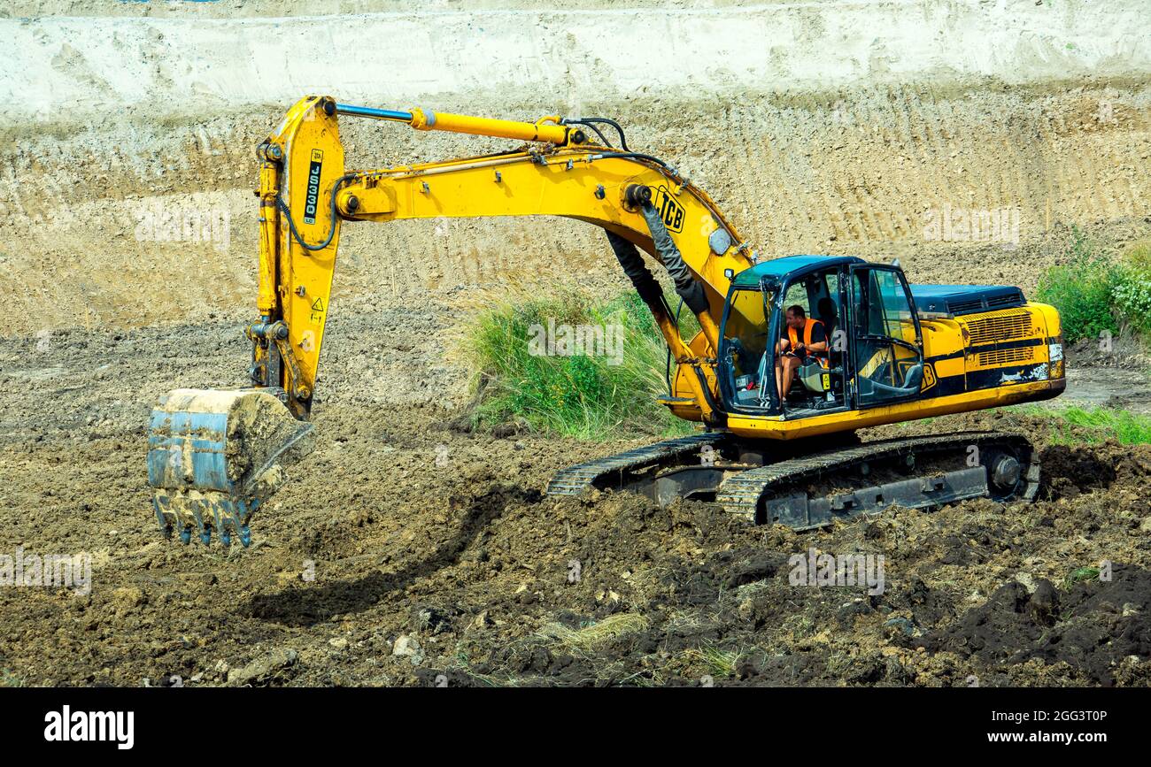 Dnepropetrovsk, Ukraine - 08.17.2021: The excavator works at a ...
