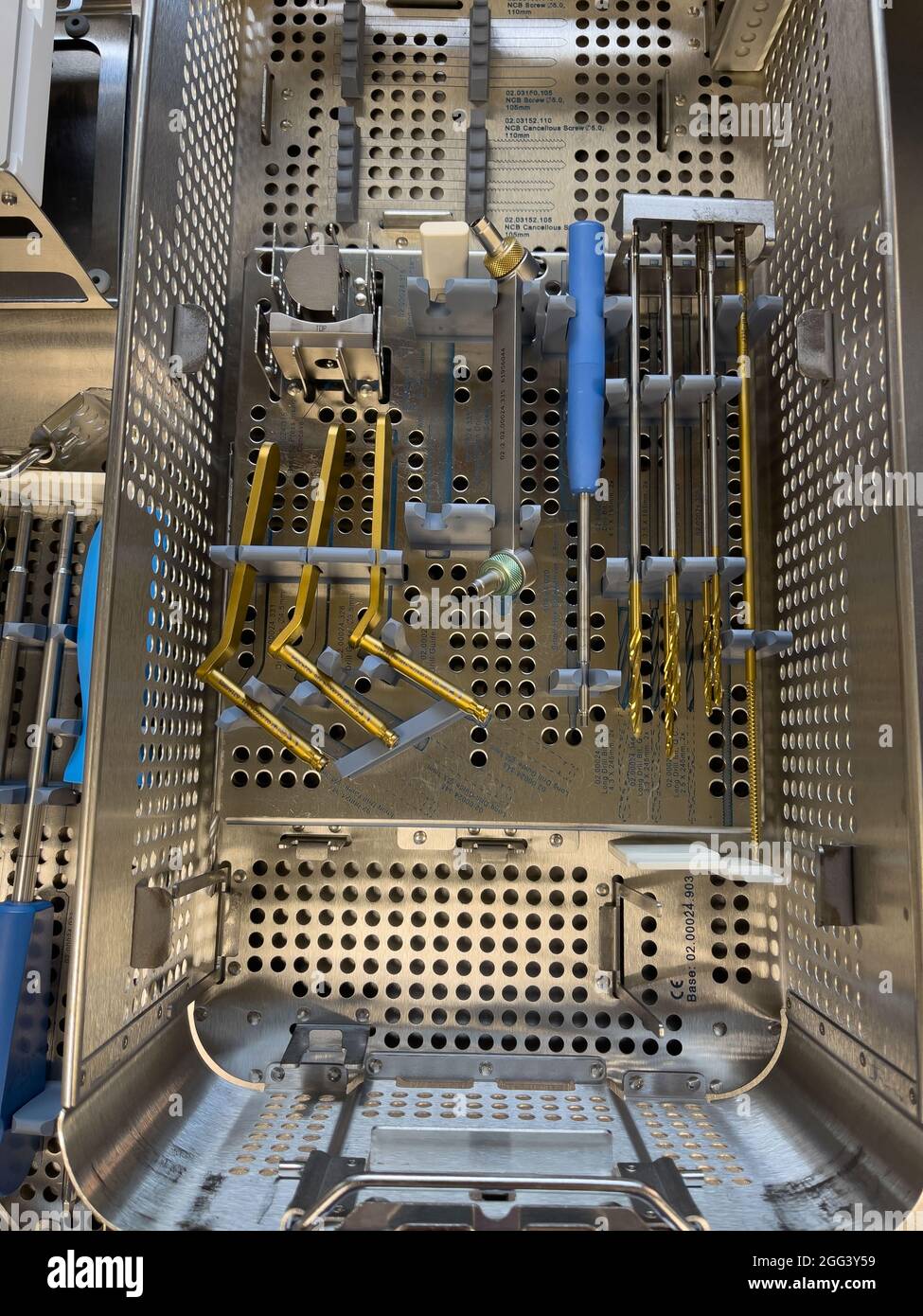 an instrument tray contains surgical instruments for implanting a ...
