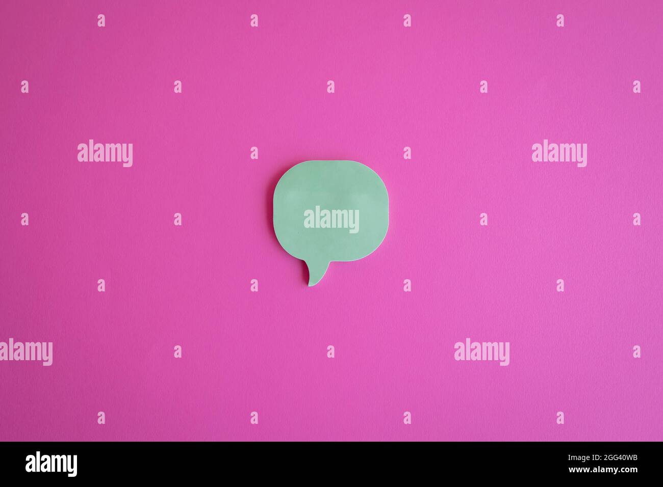Cutout of a message icon on a pink background Stock Photo - Alamy