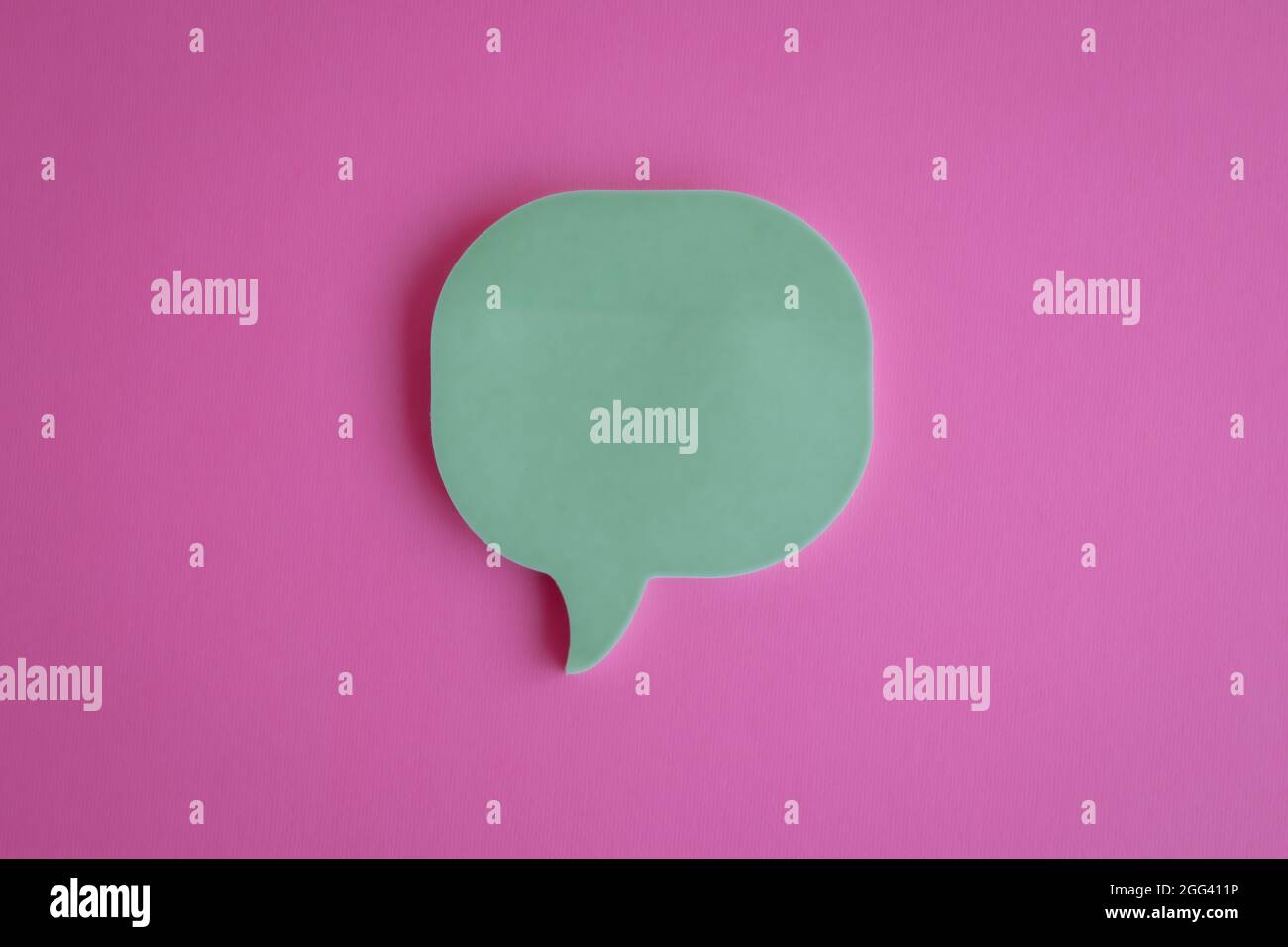 Cutout of a message icon on a pink background Stock Photo - Alamy