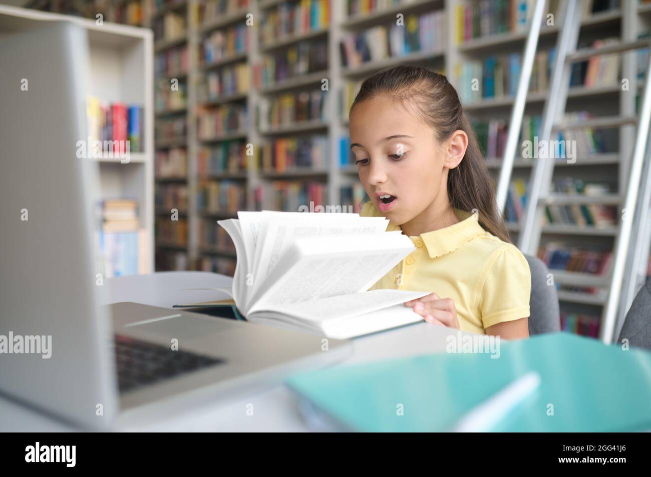 Surprised person reading book hi-res stock photography and images - Alamy