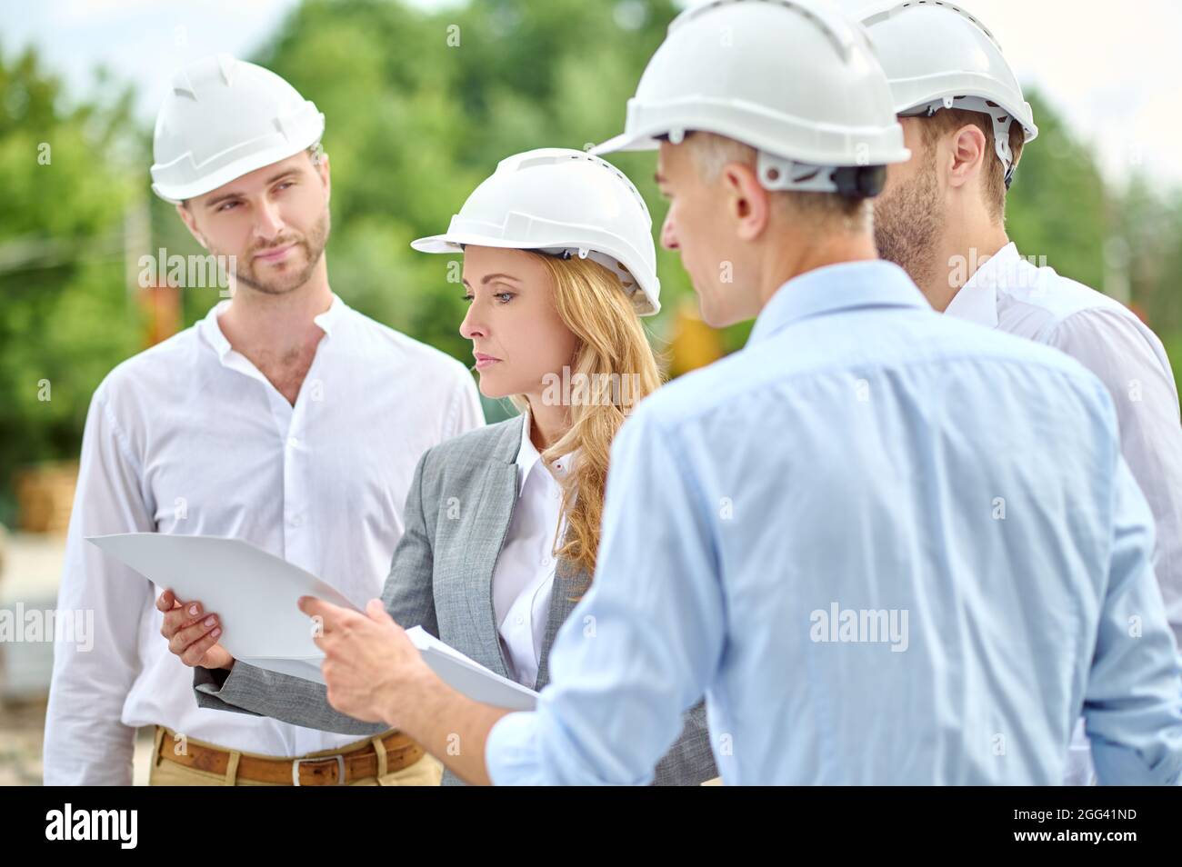 Female construction worker checking hi-res stock photography and images ...