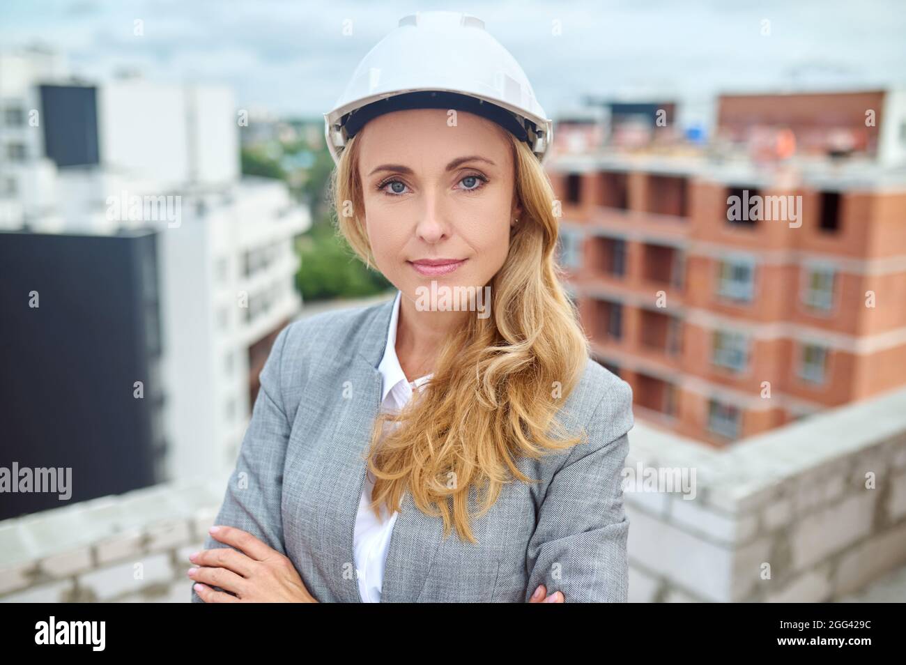 Calm construction manager in a safety helmet looking ahead Stock Photo ...