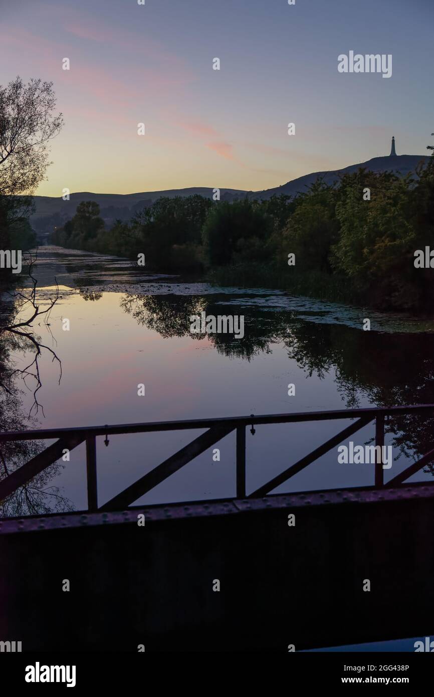 Sunset view of the Ulverston Canal with the Sir John Barrow Monument in ...