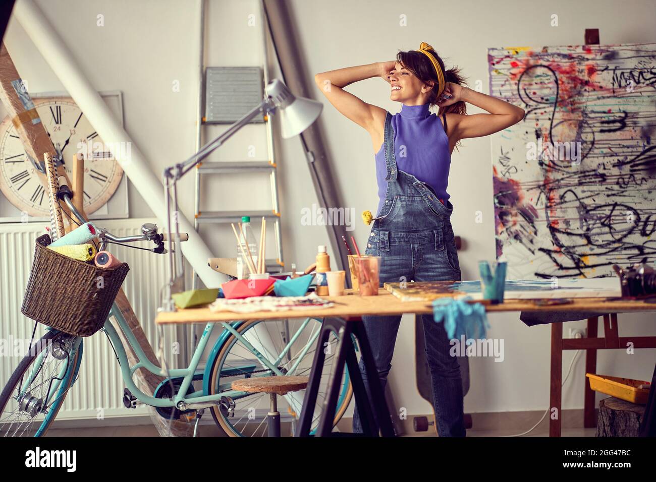 Creative female painter artist working in the studio Stock Photo - Alamy