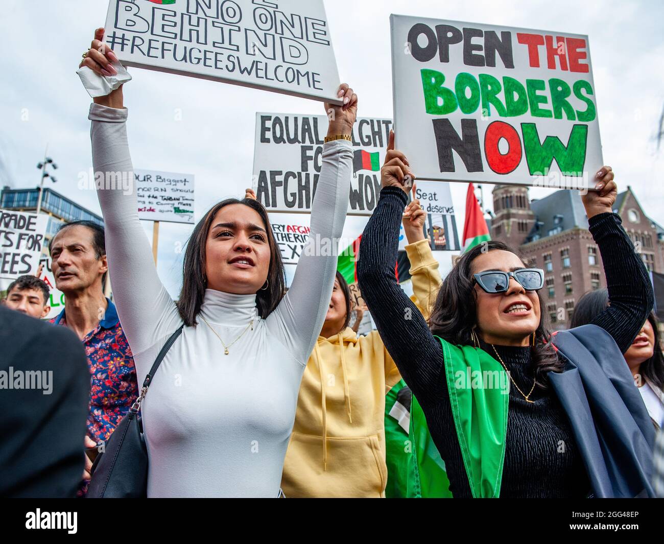 Amsterdam, Netherlands. 28th Aug, 2021. Protesters hold placards during ...