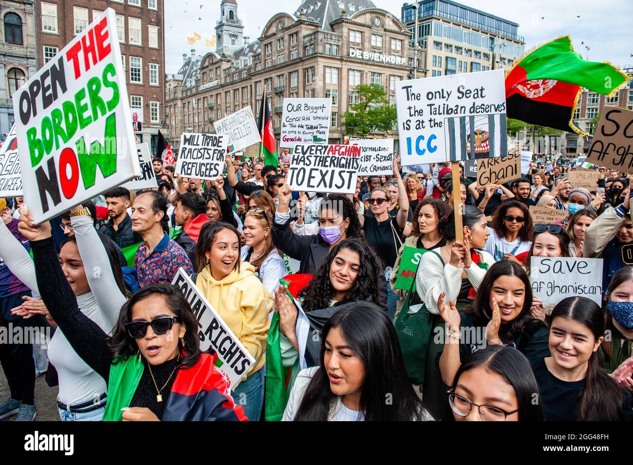 Amsterdam, Netherlands. 28th Aug, 2021. Protesters hold placards during ...