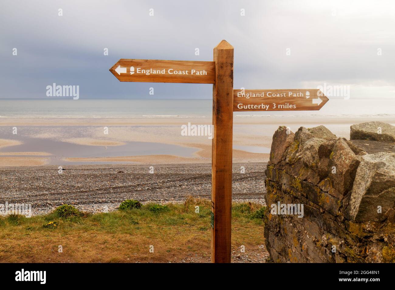 The beach at Silecroft, and a sign indicating the start of a section of ...