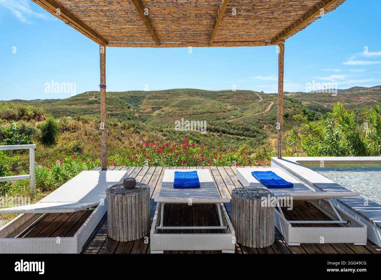 Sun beds with towels for sunbathing with a beautiful view of nature ...