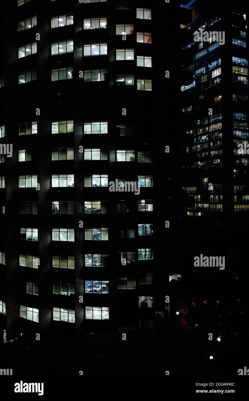 Office Buildings at night with lightened windows Stock Photo - Alamy
