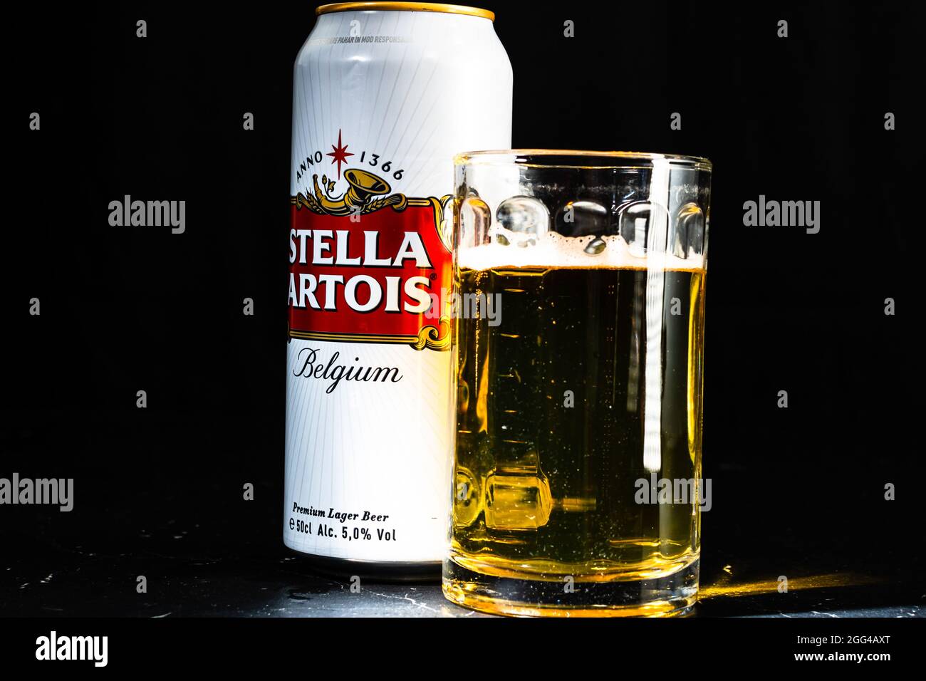Can of Stella Artois beer and beer glass on dark background ...