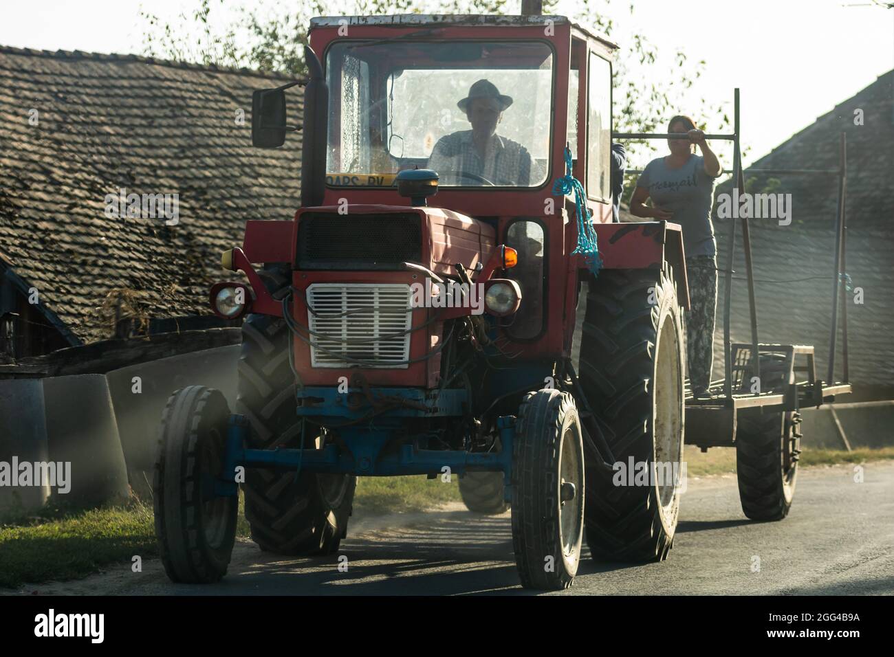 Agricultural tractor on road in Viscri, Romania, 2021 Stock Photo - Alamy